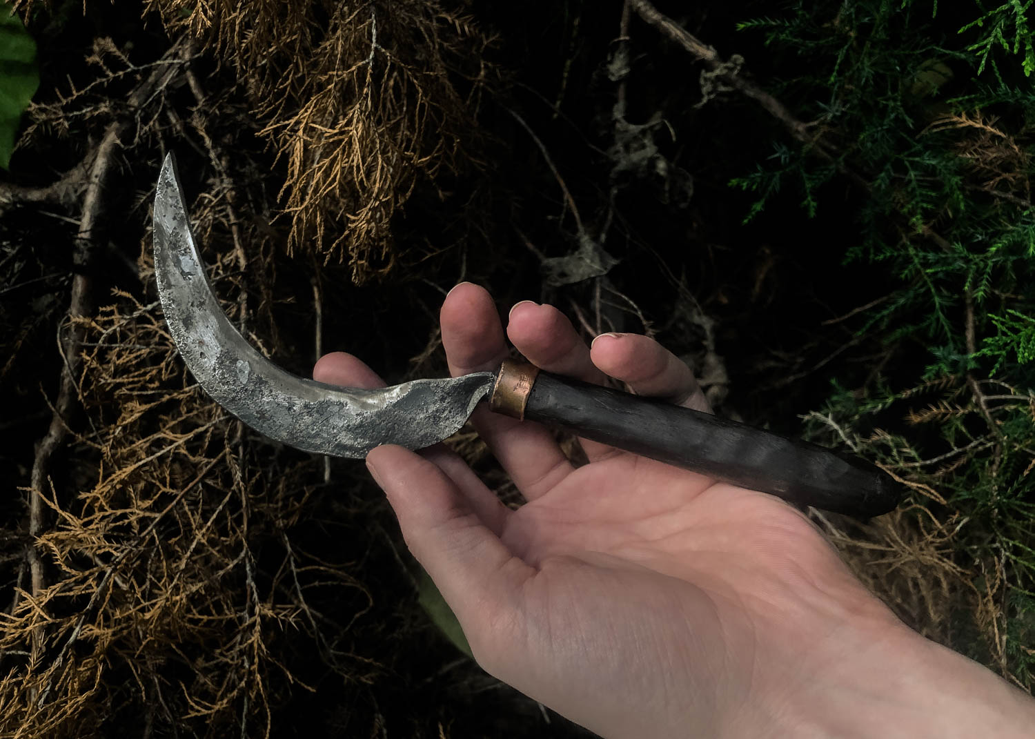 Hand holding small boline